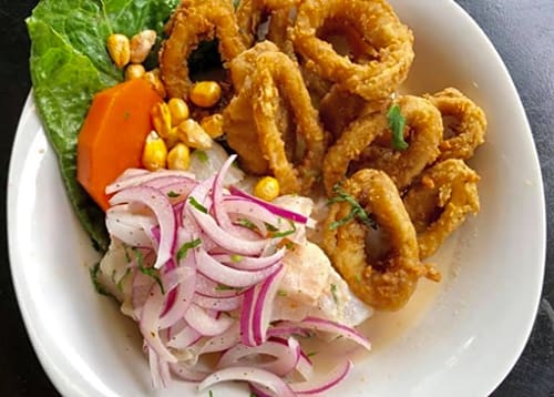 slide 7 of 9. Uploaded merchant gallery slide for Pio Pio Peruvian Cuisine.