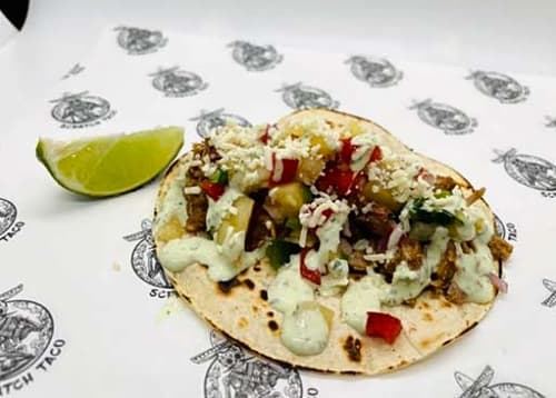 slide 1 of 10. Uploaded merchant gallery slide for Scratch Taco.